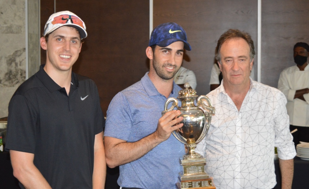 Brett receiving the trophy from the Club Captain Matt Rosen (left)
